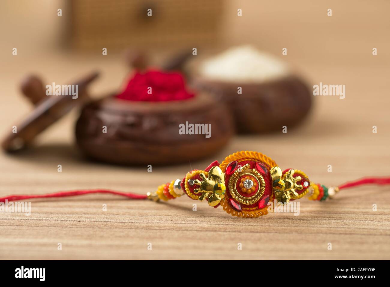 Indian festival: Raksha Bandhan background with an elegant Rakhi, Rice ...