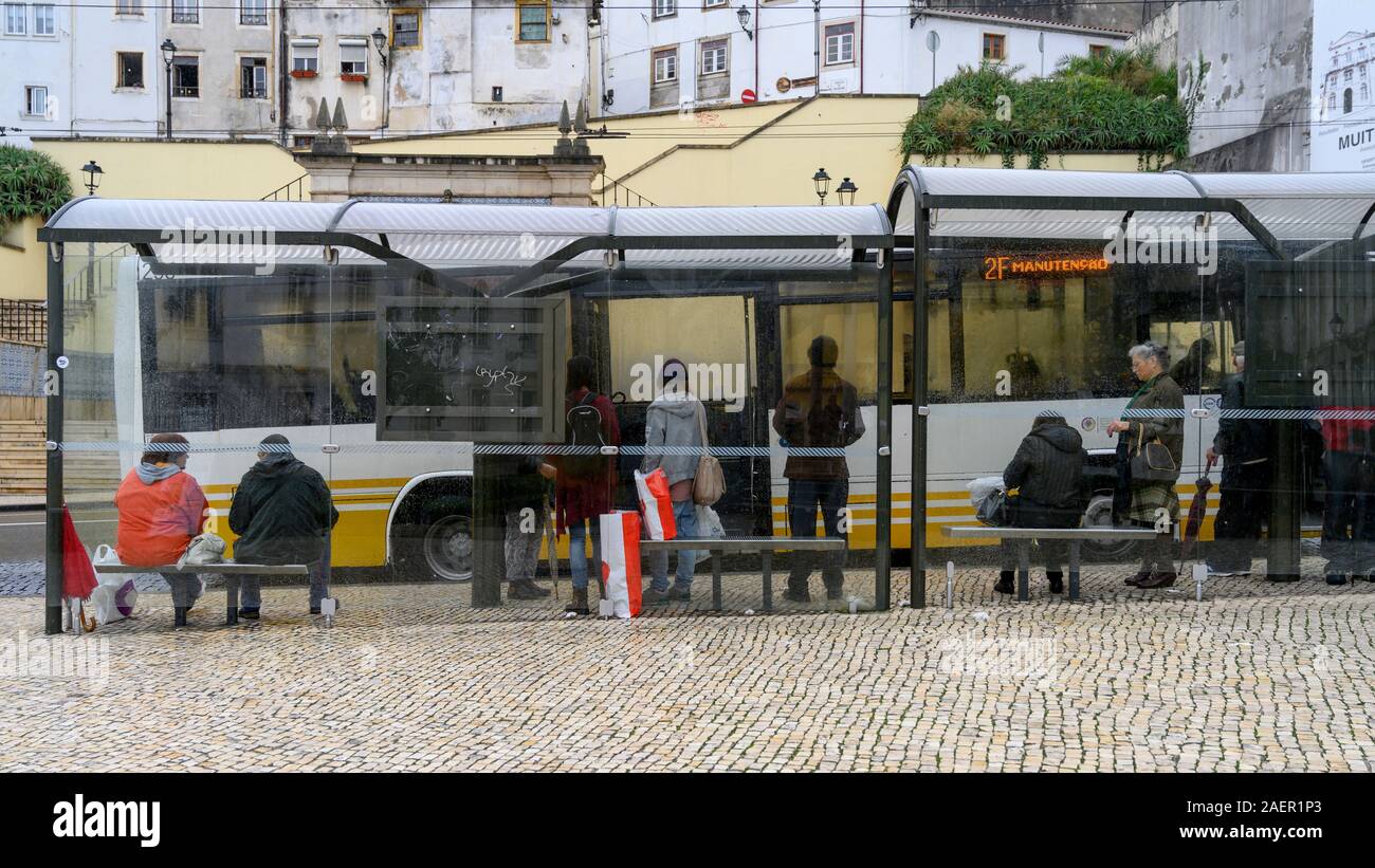Passengers waiting at bus stop, Coimbra, Coimbra District, Portugal ...