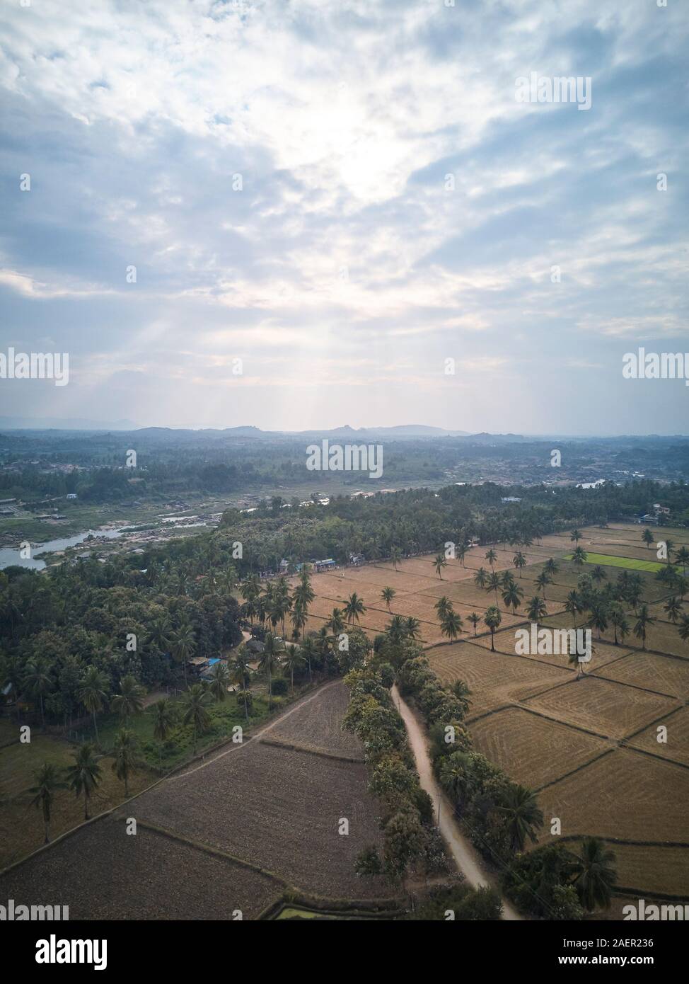 A view from Sunset Point of fields and the River Tungabhadra in Hampi ...