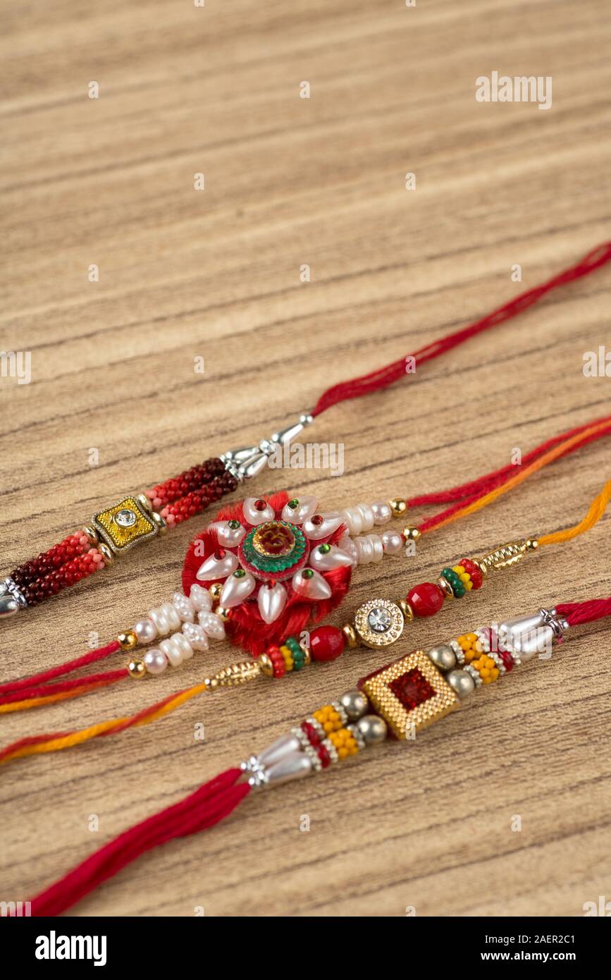 Raksha Bandhan background with an elegant Rakhi . A traditional Indian ...