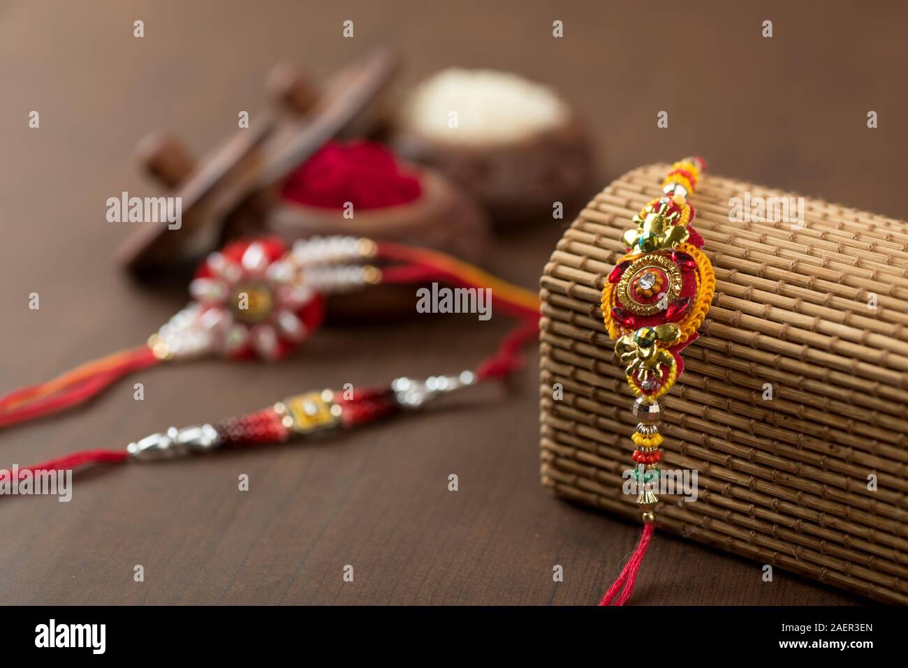 Indian festival: Raksha Bandhan background with an elegant Rakhi, Rice ...