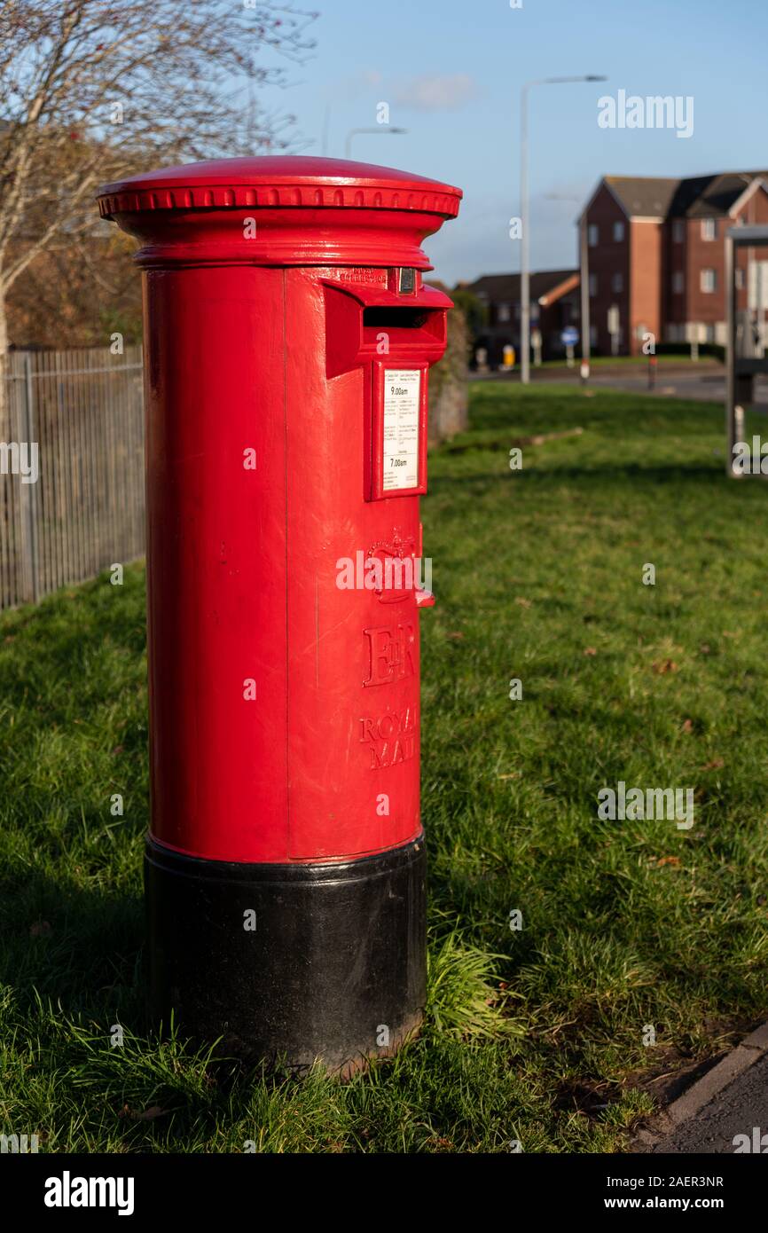 A classic vintage red mailbox for posting letters in a Street in Wales ...