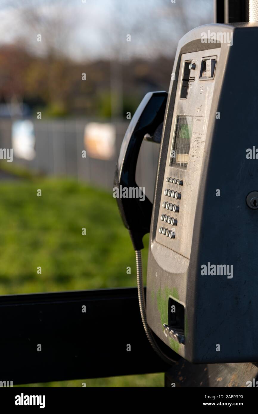 Close up of a telephone in an outdoor public phone booth box in United ...