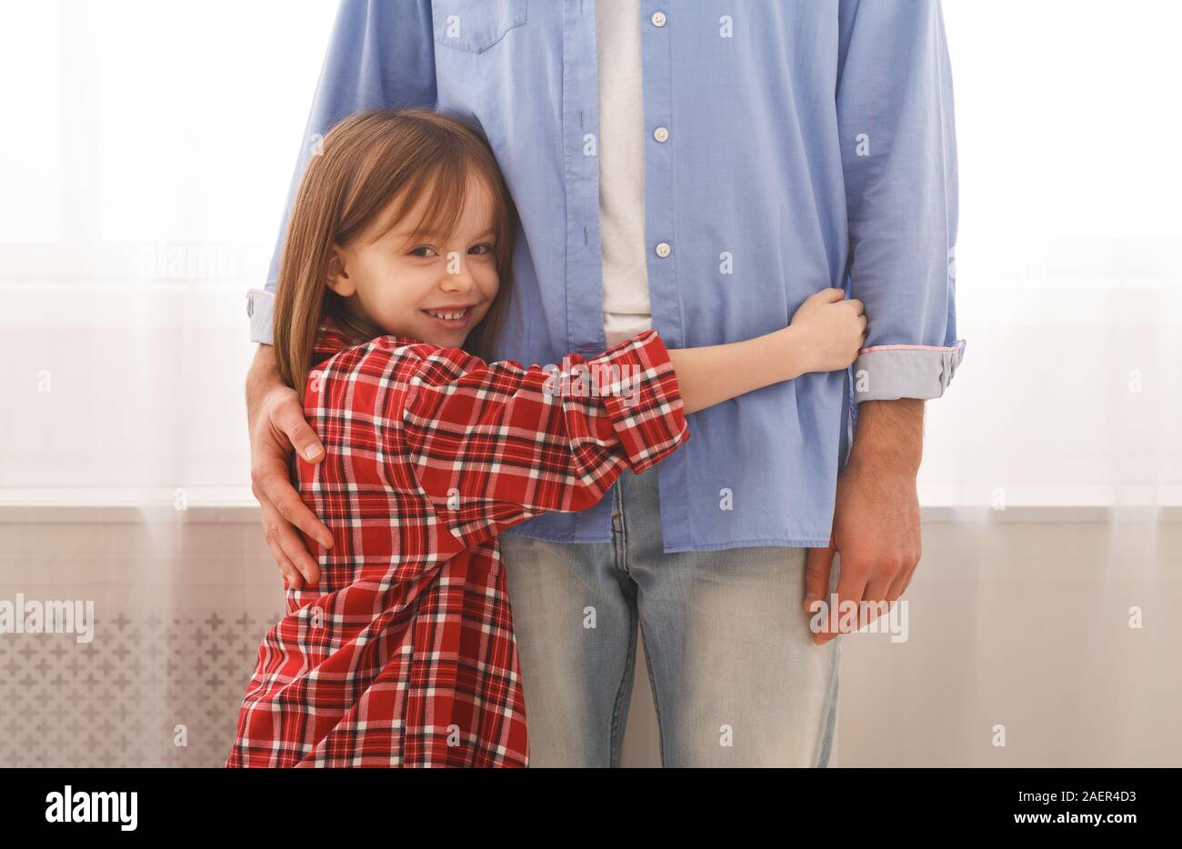Cute smiling little girl hugging her daddy Stock Photo - Alamy