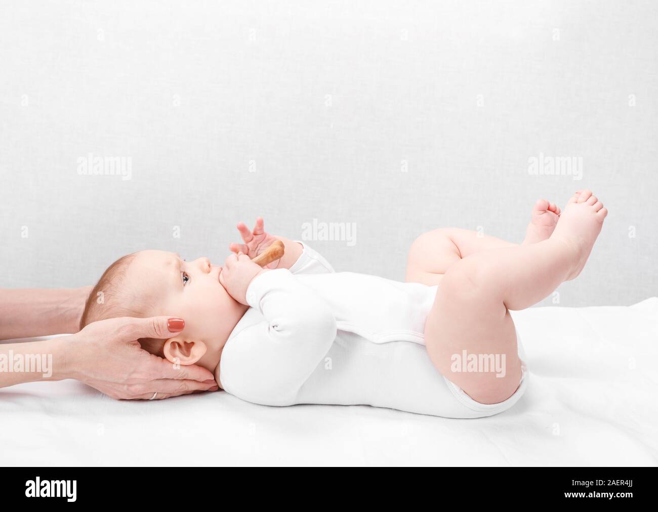 Six month baby girl receiving osteopathic or chiropractic treatment in ...