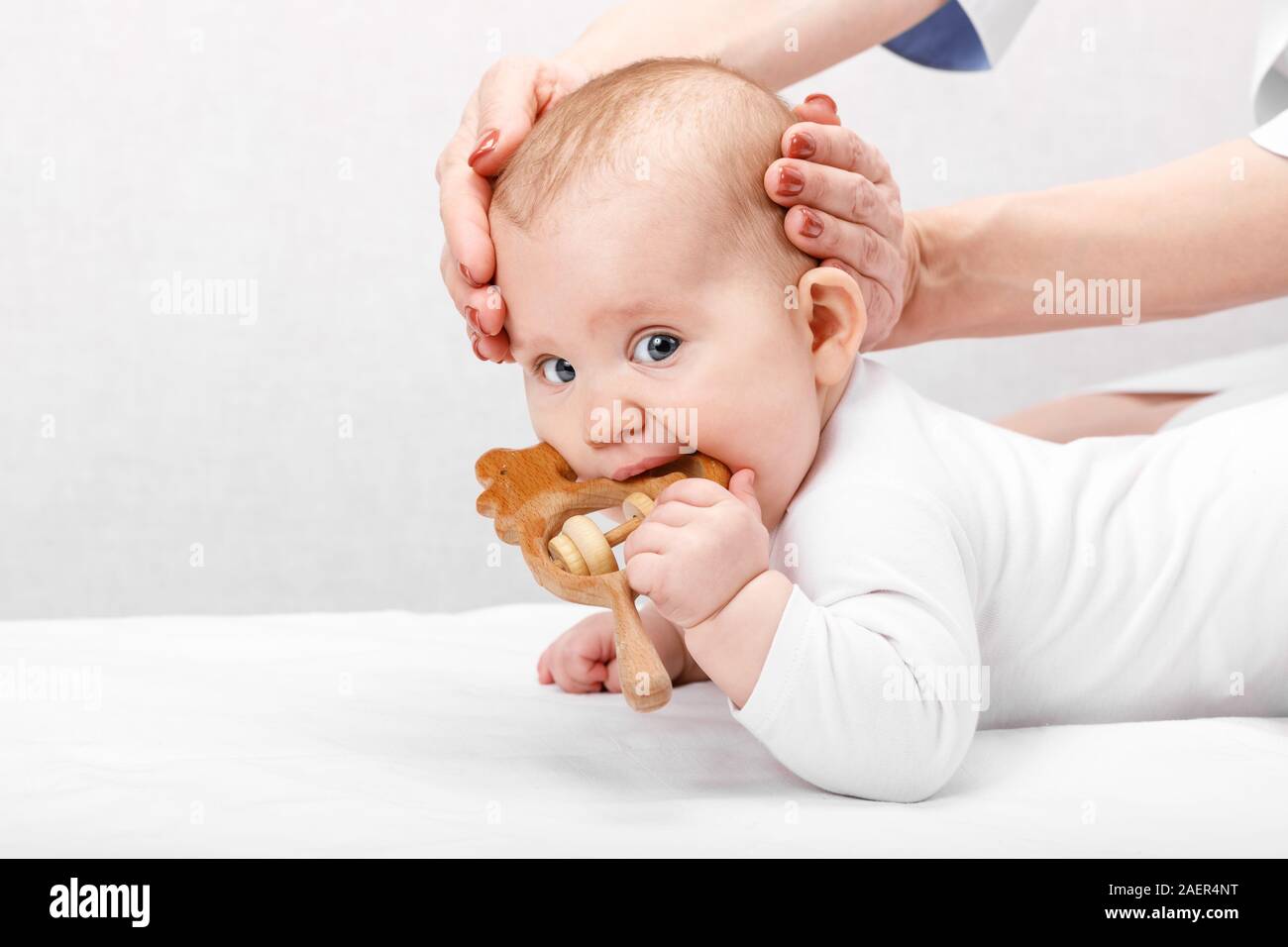 Six month baby girl receiving osteopathic or chiropractic treatment in ...