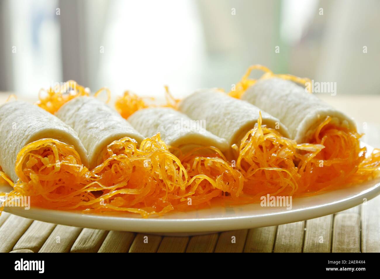 bread roll golden threads applied dessert on dish Stock Photo - Alamy
