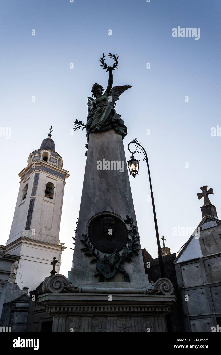 Sculpture of an angel in the sky with a laurel crown Stock Photo - Alamy