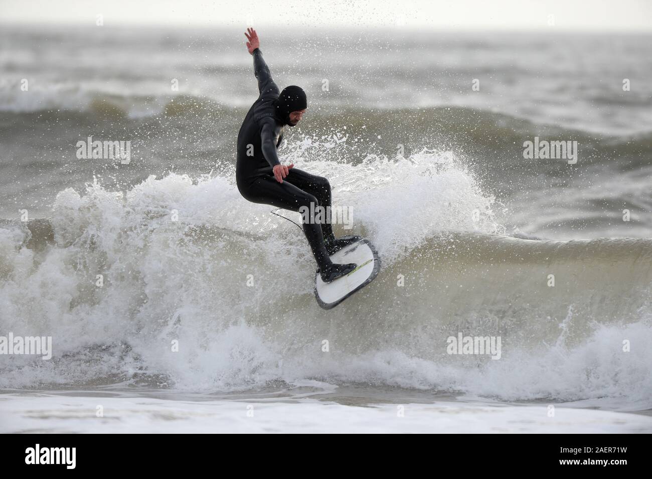 Surfer floats over the close out section of the wave Stock Photo - Alamy