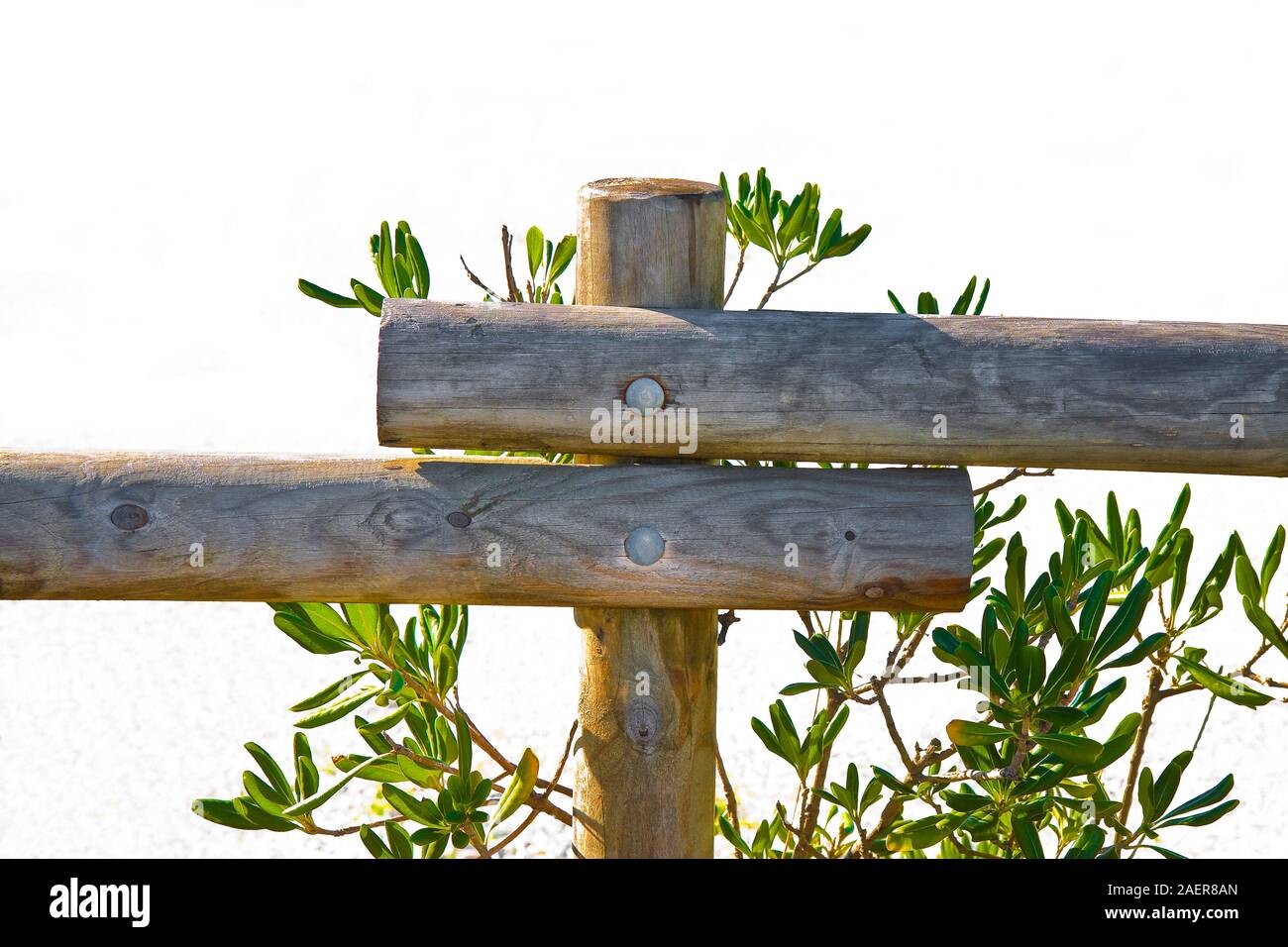 Detail of a wooden fence built with poles split in half Stock Photo - Alamy