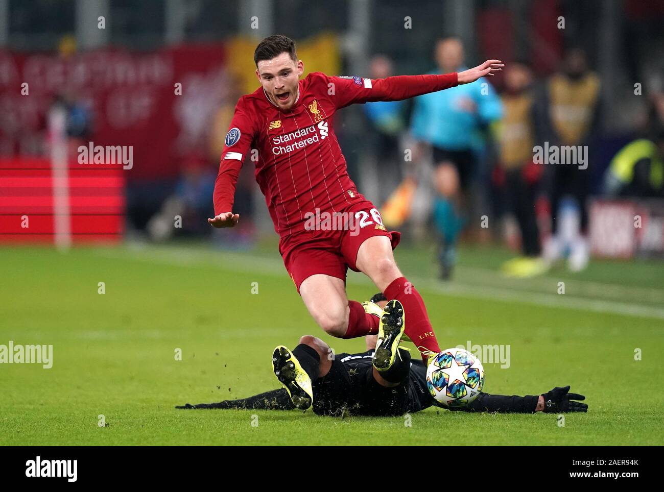 Red Bull Salzburg's Hee-Chan Hwang (bottom) makes a tackle on Liverpool ...