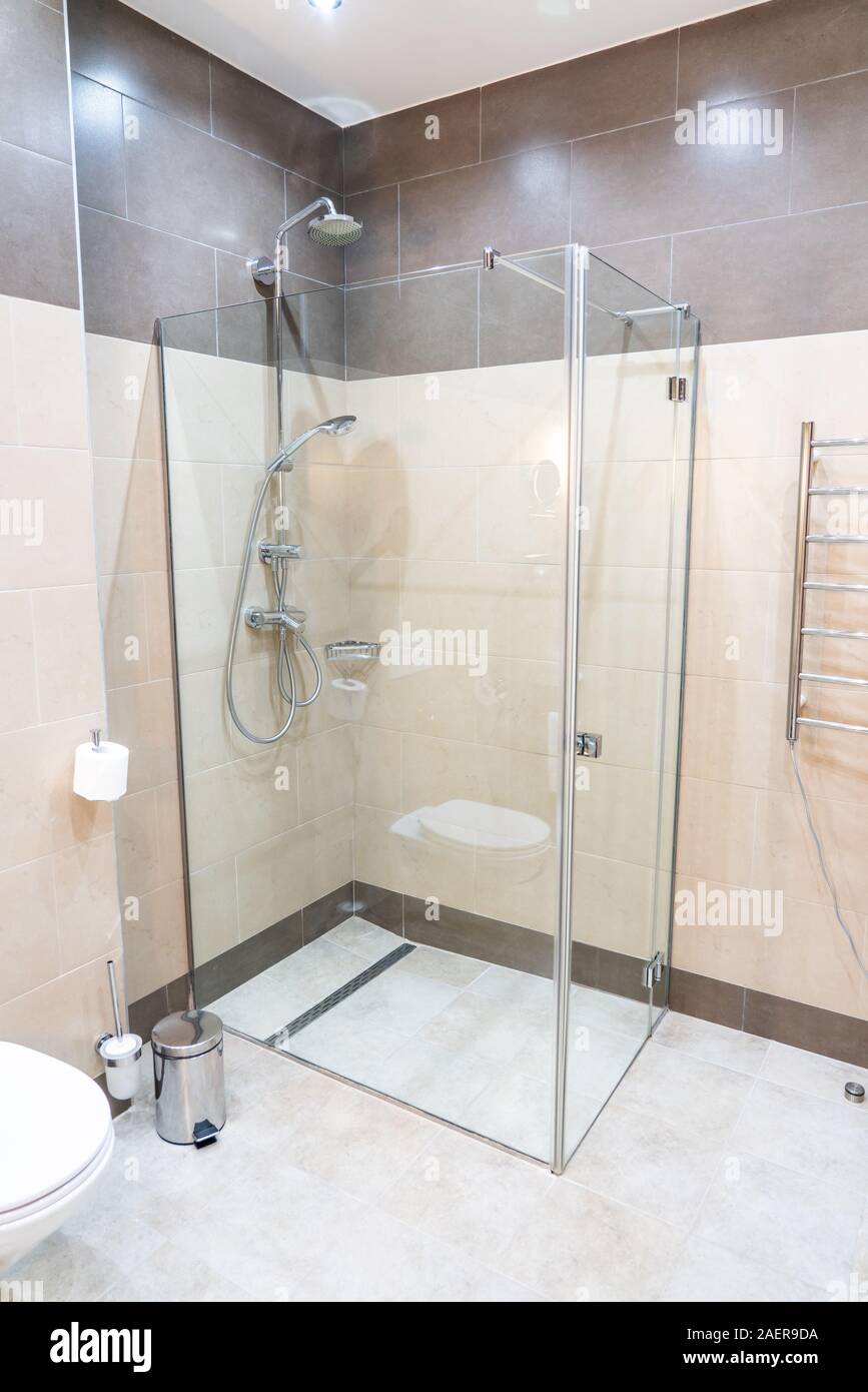Glass shower walk in cabin in a modern interior Stock Photo - Alamy