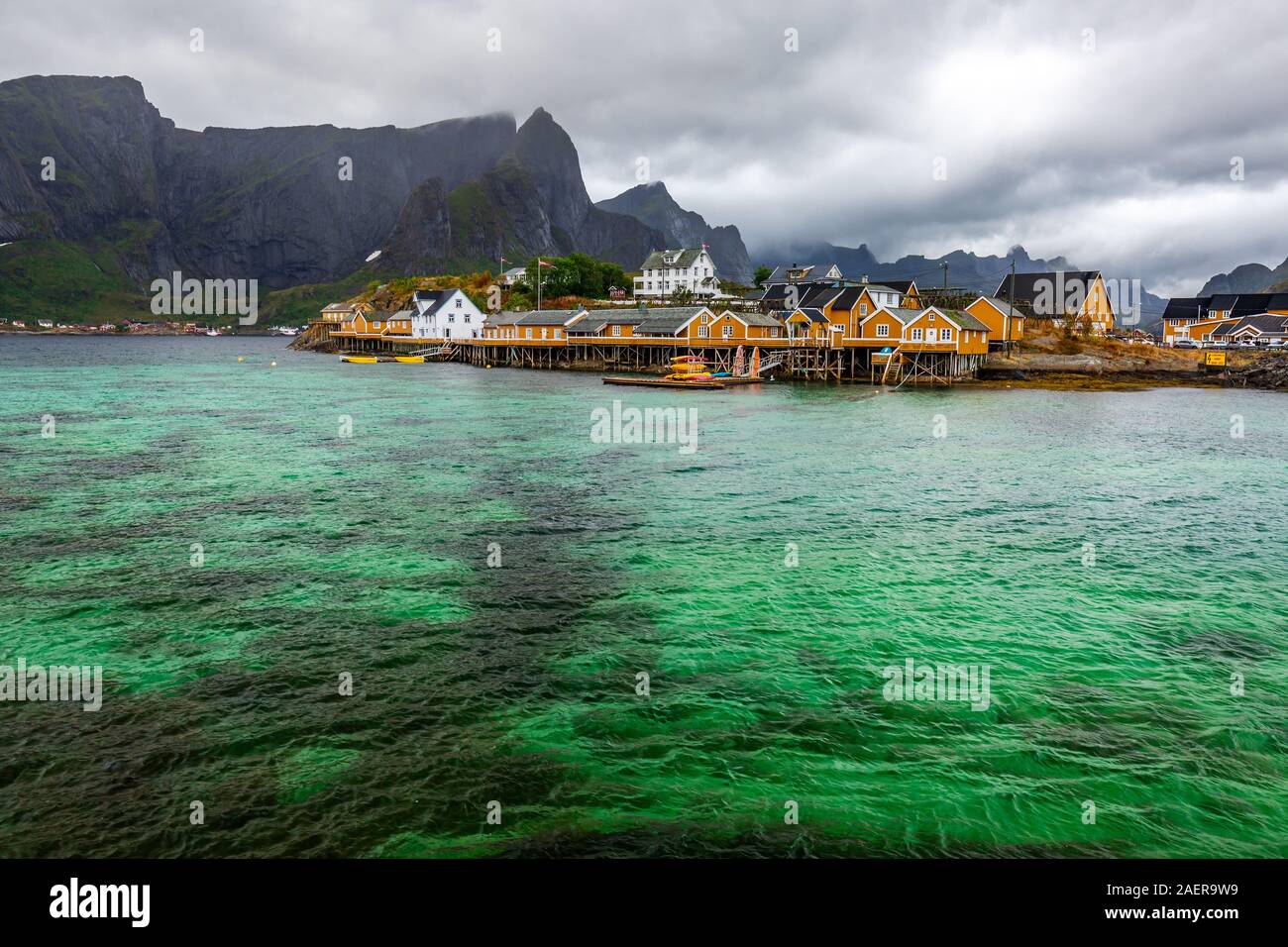 A yellow fishing cabin in Sakrisoy, a small fishing village in Moskenes ...