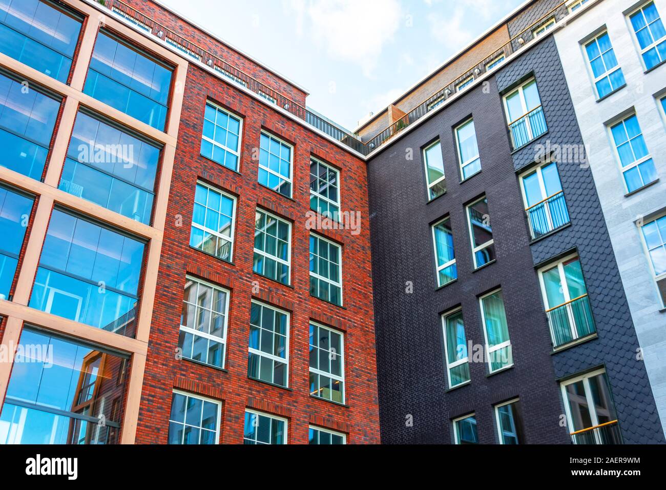 View of a new residential rectangular modern inside corner red and ...