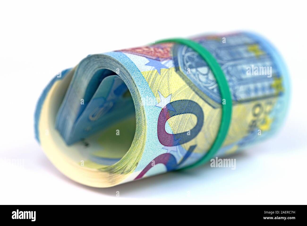 Lots of rolled up banknotes in front of a white background Stock Photo ...