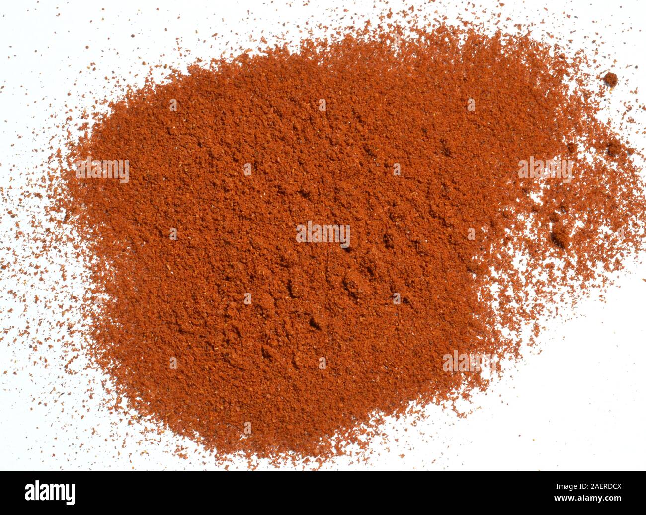 Red chili pepper powder on white background Stock Photo - Alamy