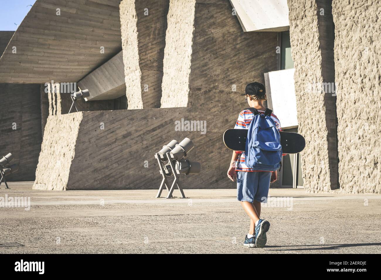School boy walking out of school hi-res stock photography and images ...