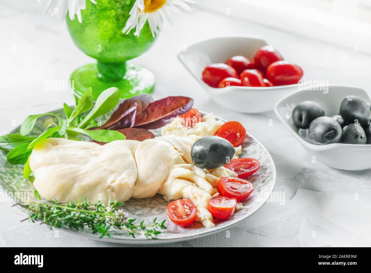 Traditional white soft fiber Cecil cheese in the shape of a pigtail ...