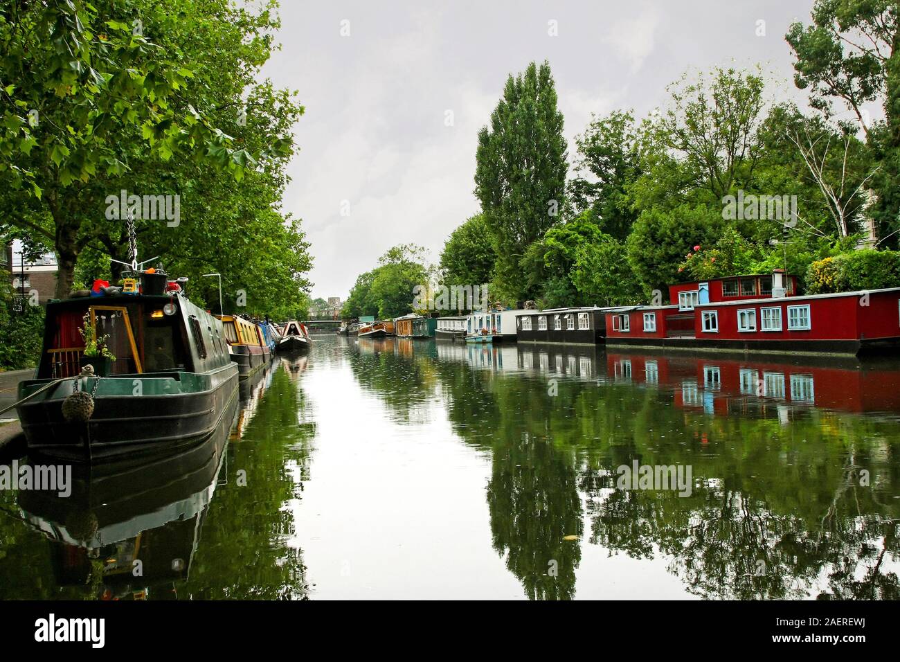 Big channel way with long narrow boats Stock Photo - Alamy