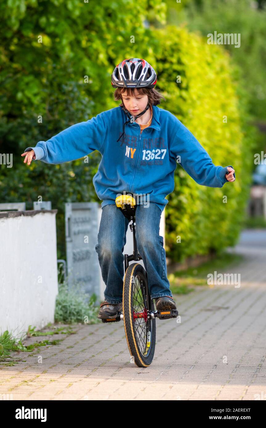 Boy unicycle hi-res stock photography and images - Alamy