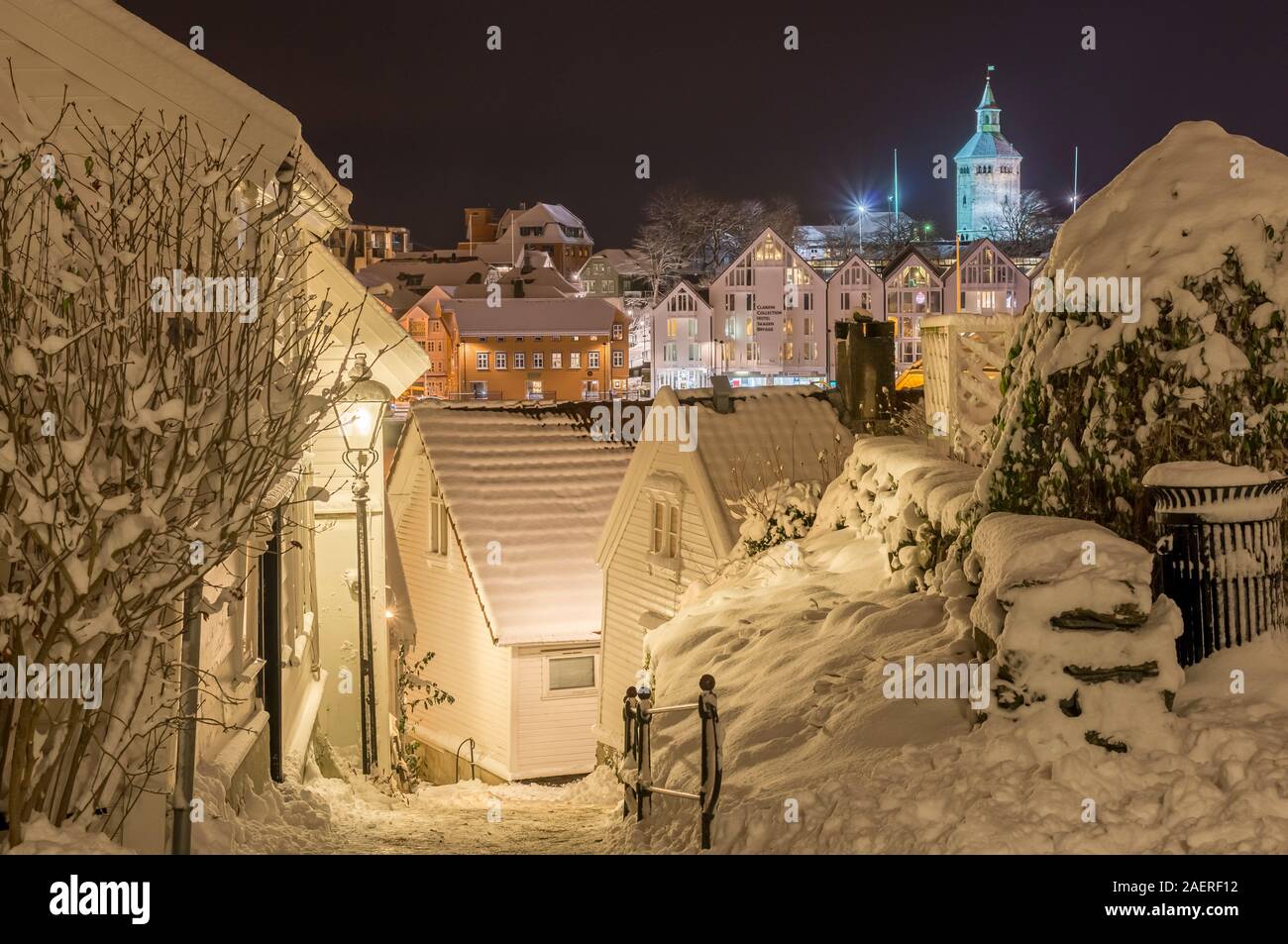Snow-covered wooden buildings, night scene, historic town centre ...