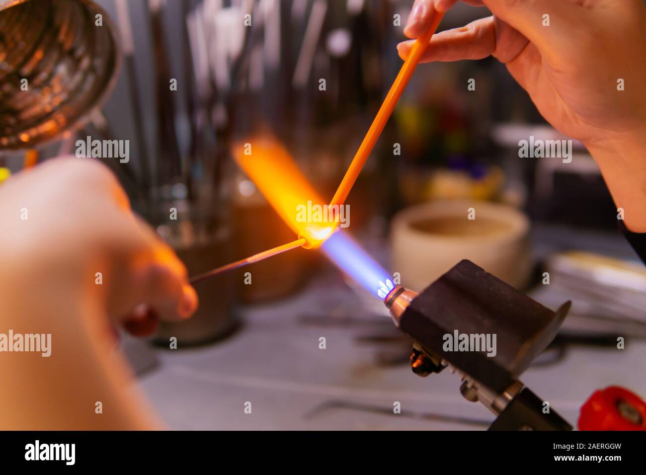 beadmaking - making glass beads manually by the winding method in a ...