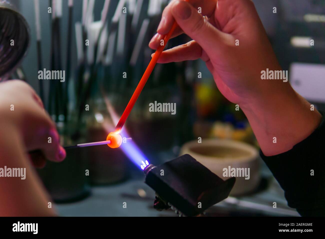 beadmaking - making glass beads manually by the winding method in a ...