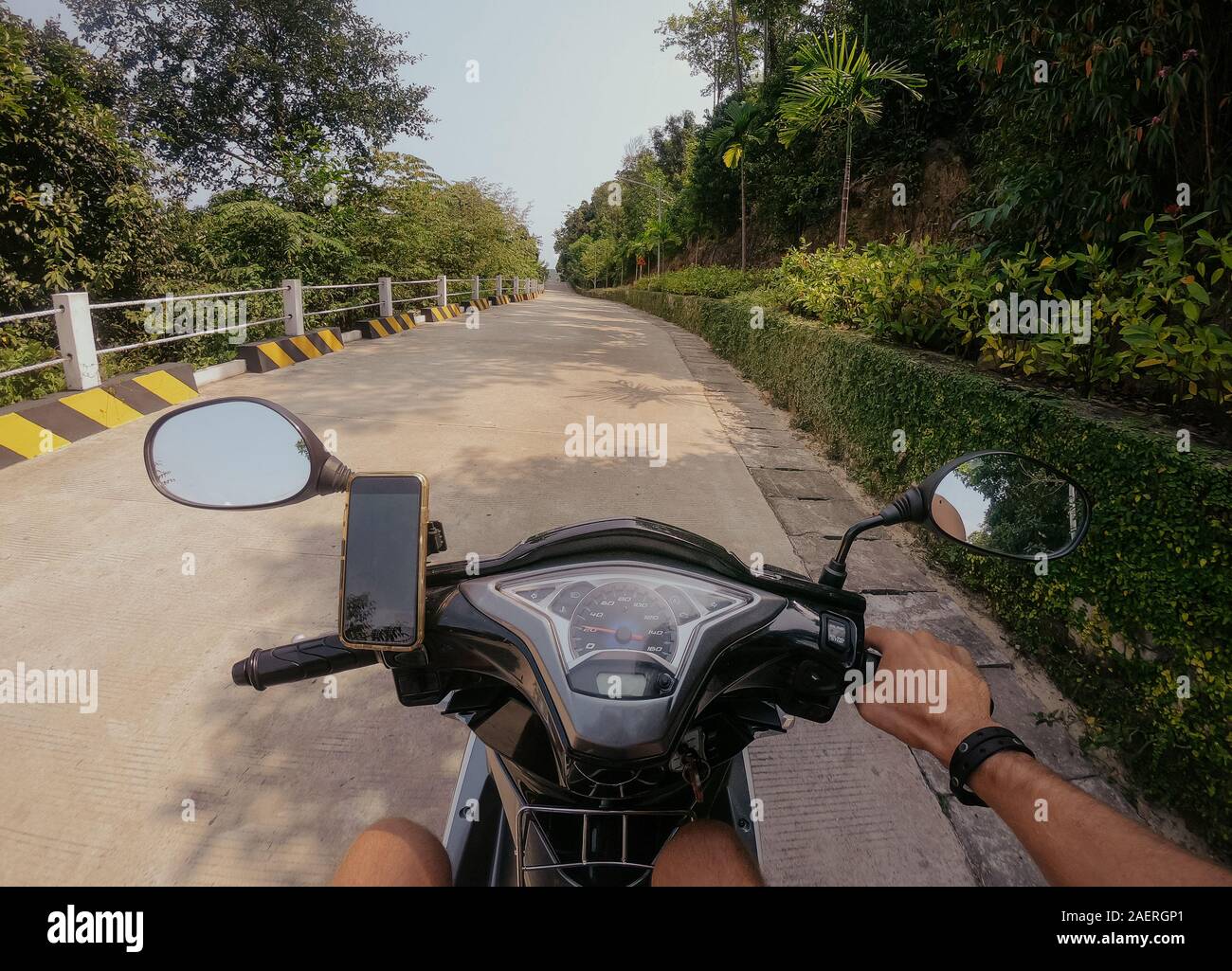 First person view motorbike drive on the road in summer Asia Stock ...