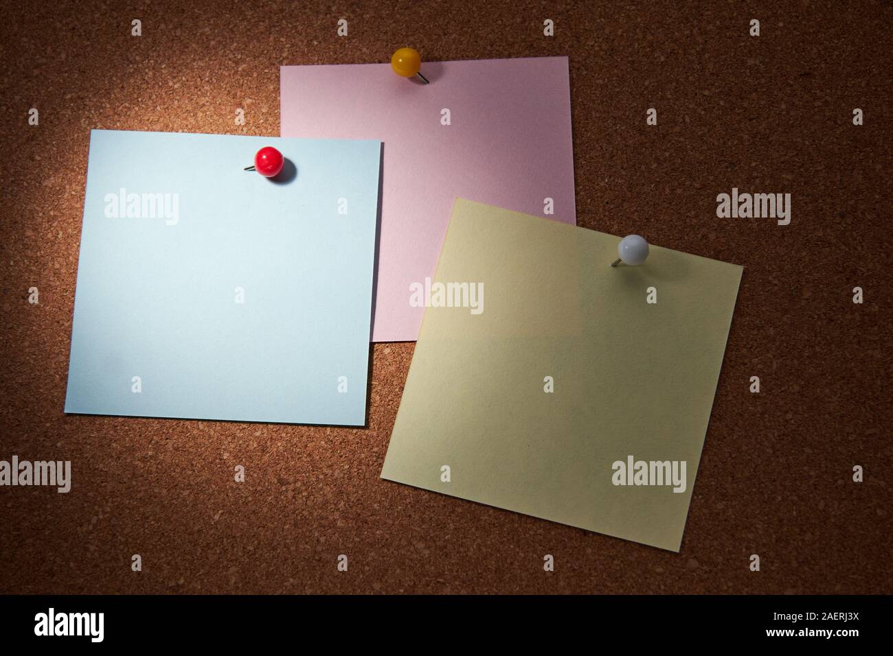 Blank paper notes attached to cork wall with push pins Stock Photo - Alamy
