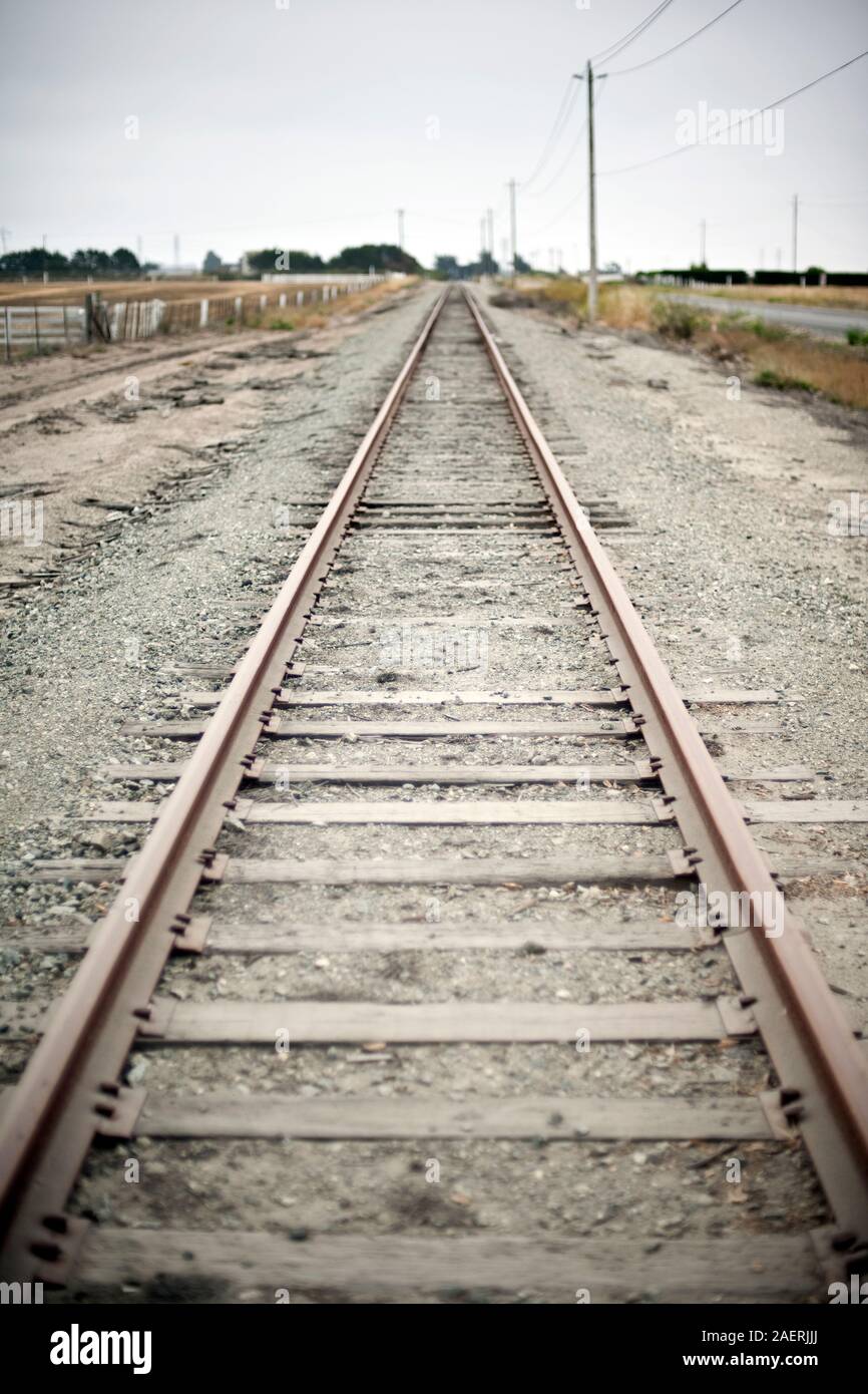 Train tracks disappearing into the distance Stock Photo - Alamy