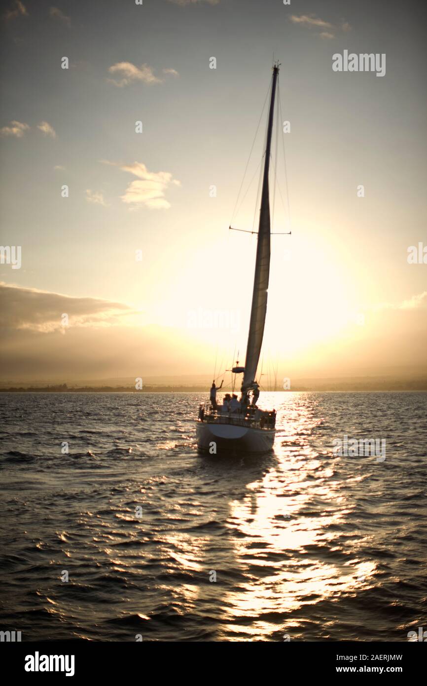 People sailing off into the sunset Stock Photo - Alamy