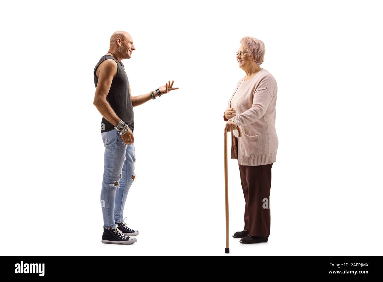 Full length profile shot of a senior woman and a male hipster having a ...