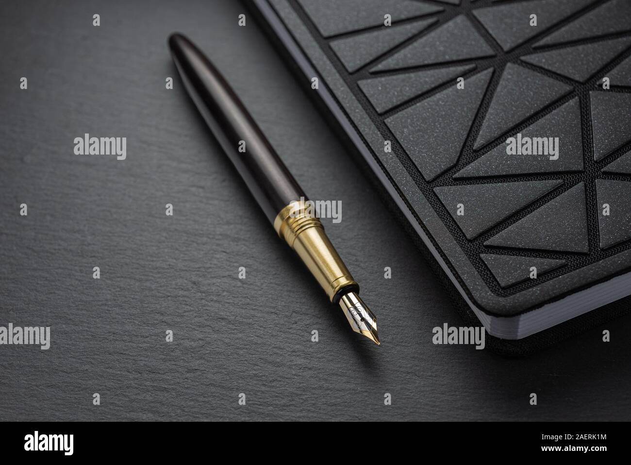 Office table with notepad, keyboard and fountain pen Stock Photo - Alamy