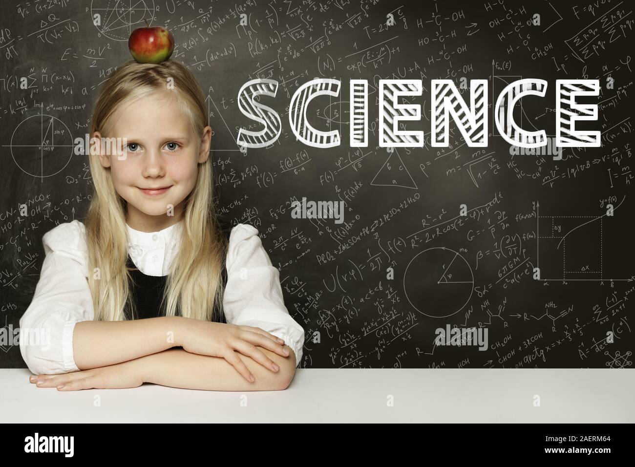 Student little girl with apple and science background Stock Photo - Alamy