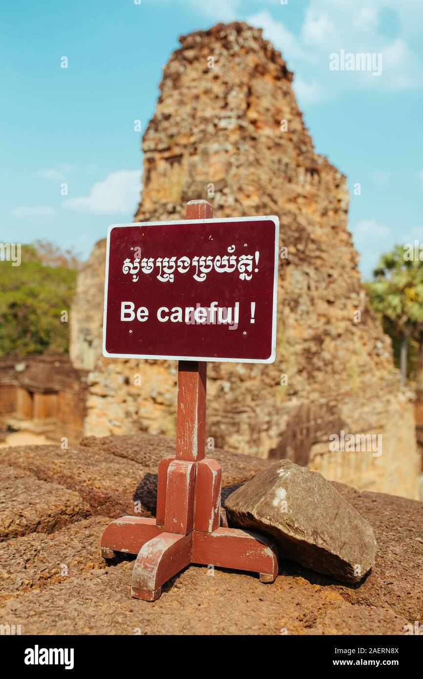 Be Careful Warning sign in Angkor Wat Temple Stock Photo - Alamy