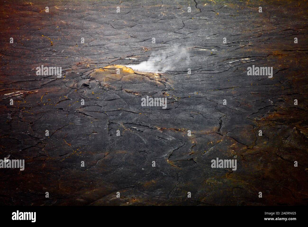 Steam rising up from a volcanic landscape Stock Photo - Alamy