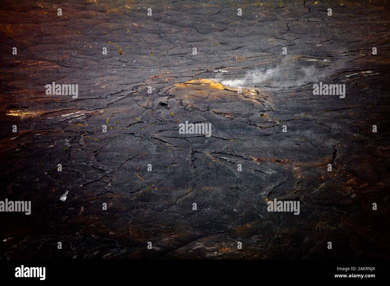 Steam rising up from a volcanic landscape Stock Photo - Alamy