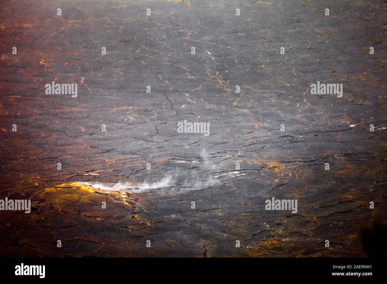 Steam rising up from a volcanic landscape Stock Photo - Alamy