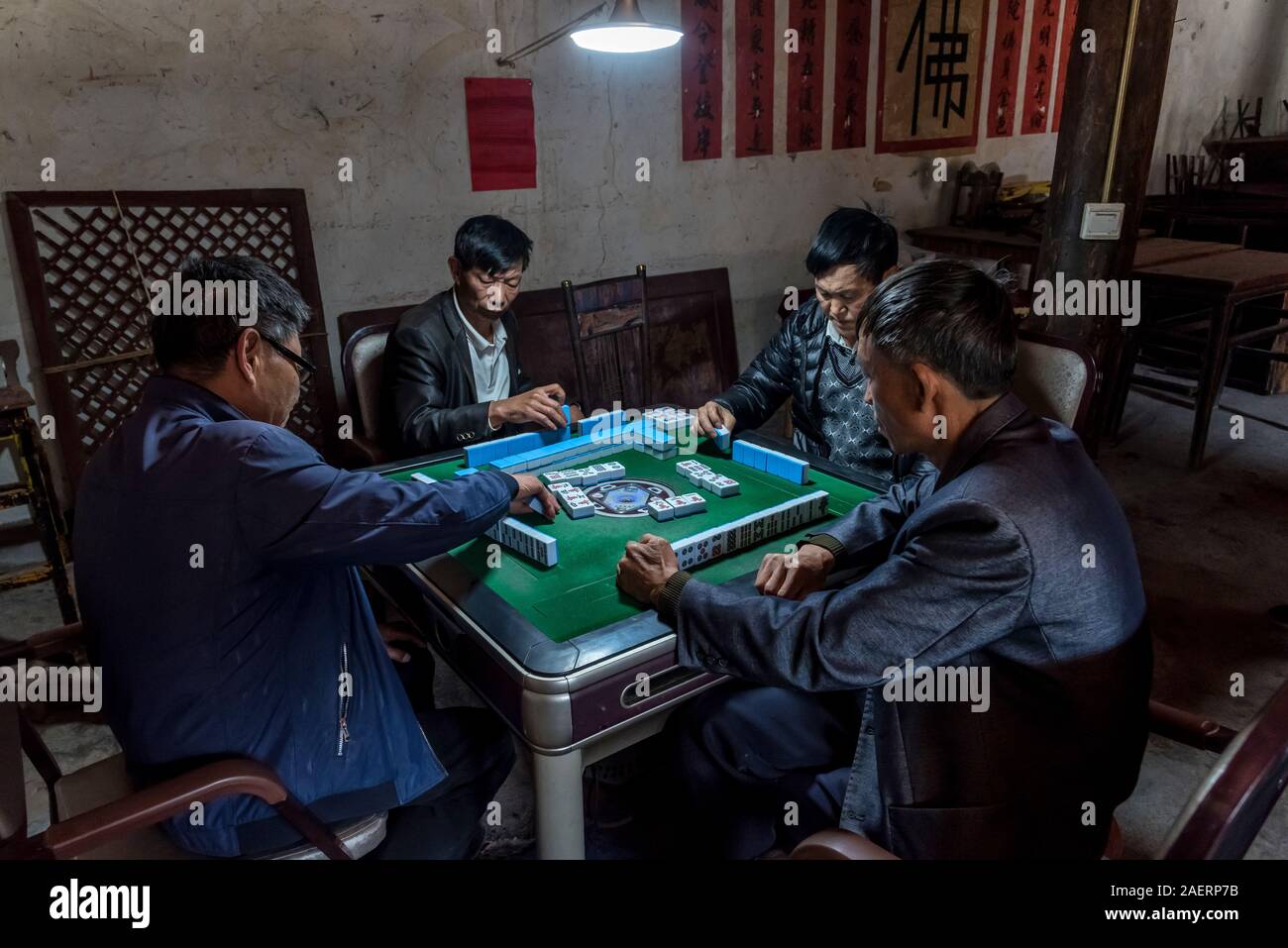 March 14, 2019: Group of chinese elder men playing mahjong in Yunnan ...