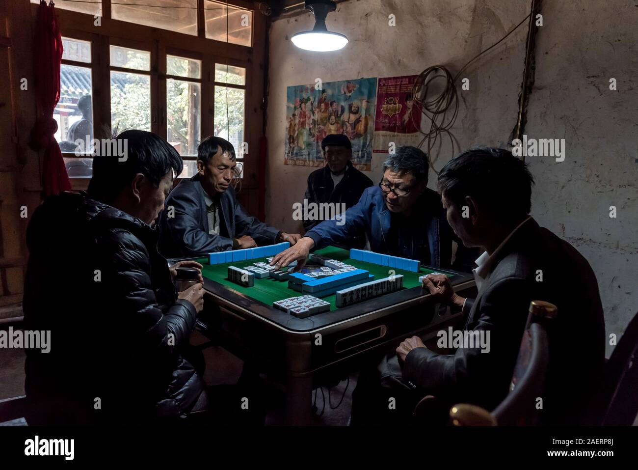 Men playing mahjong hi-res stock photography and images - Alamy