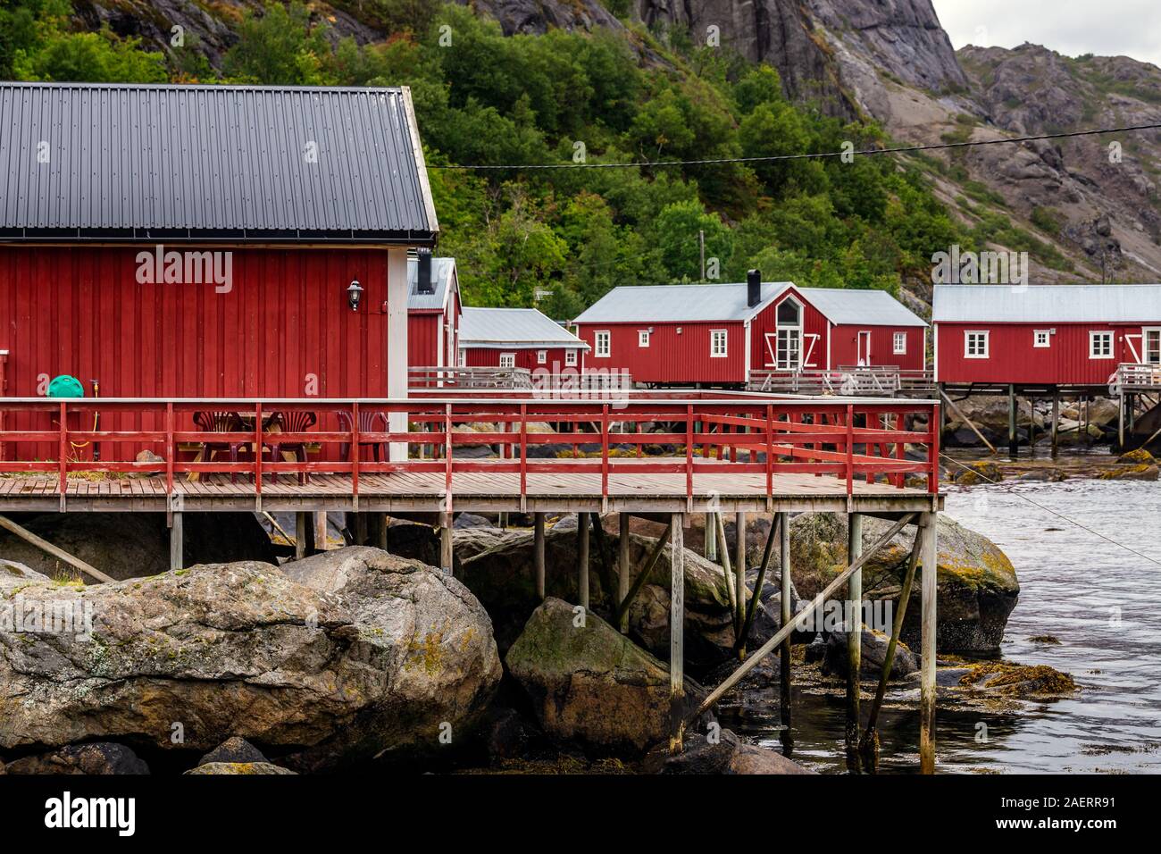 Traditional red wooden houses, rorbuer in the small fishing village of ...