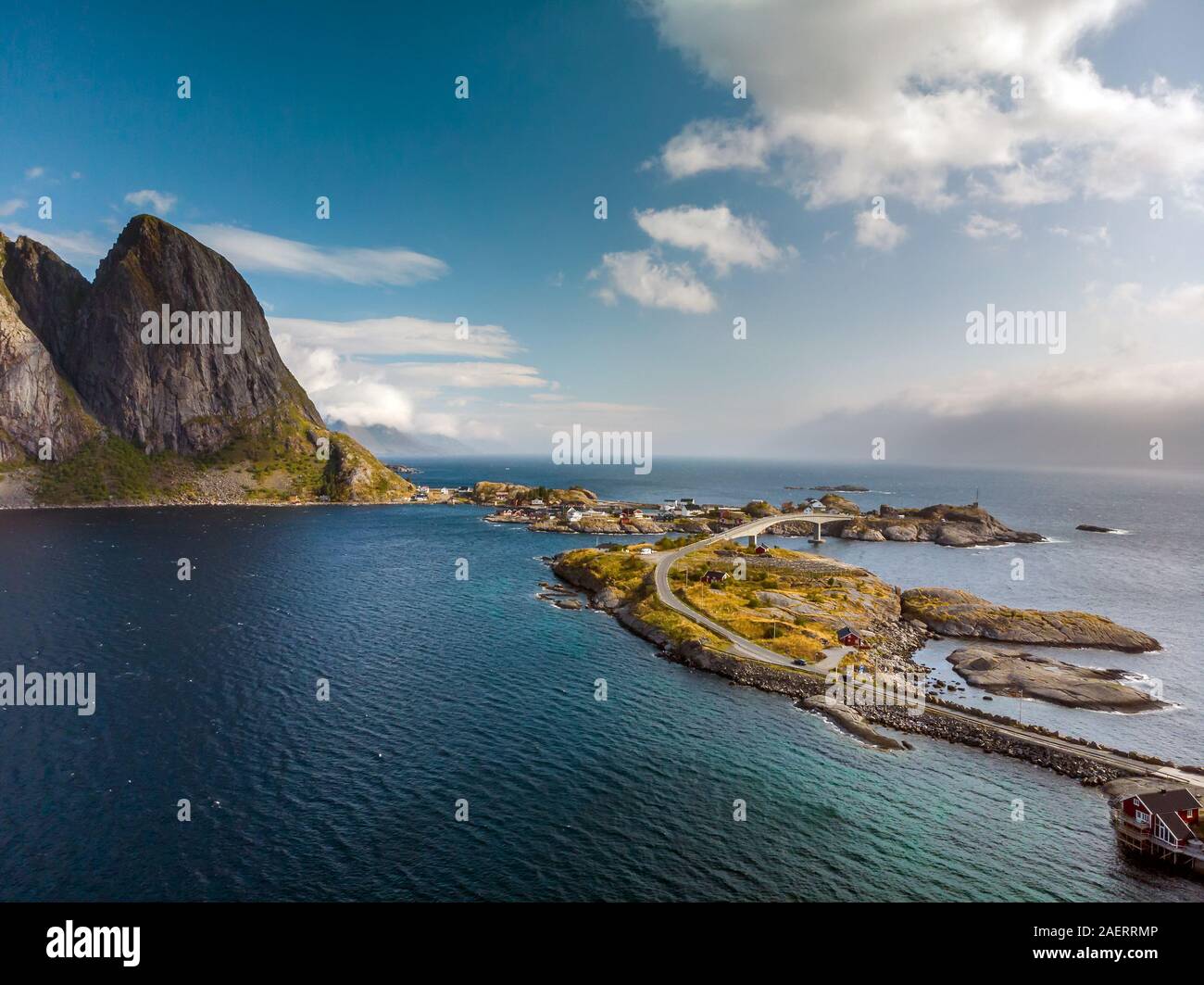 Fishing village in reine with yellow houses hi-res stock photography ...