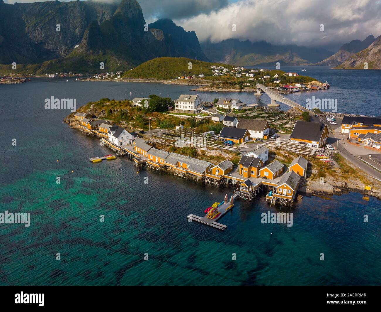 Fishing village in reine with yellow houses hi-res stock photography ...