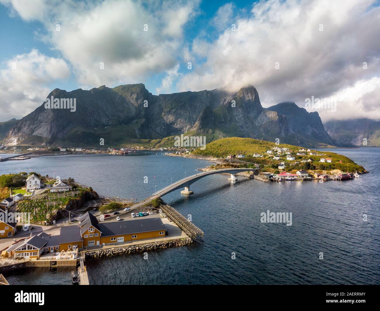 Fishing village in reine with yellow houses hi-res stock photography ...
