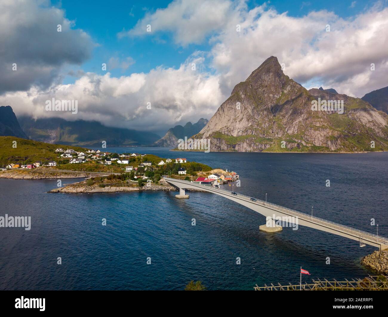 Fishing village in reine with yellow houses hi-res stock photography ...