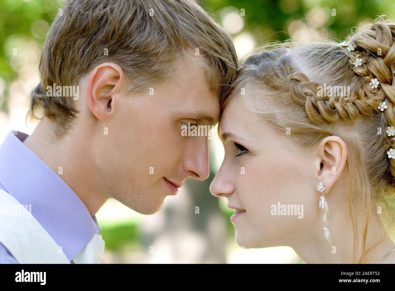 Happy couple in love looking deeply into each others eyes, touching ...