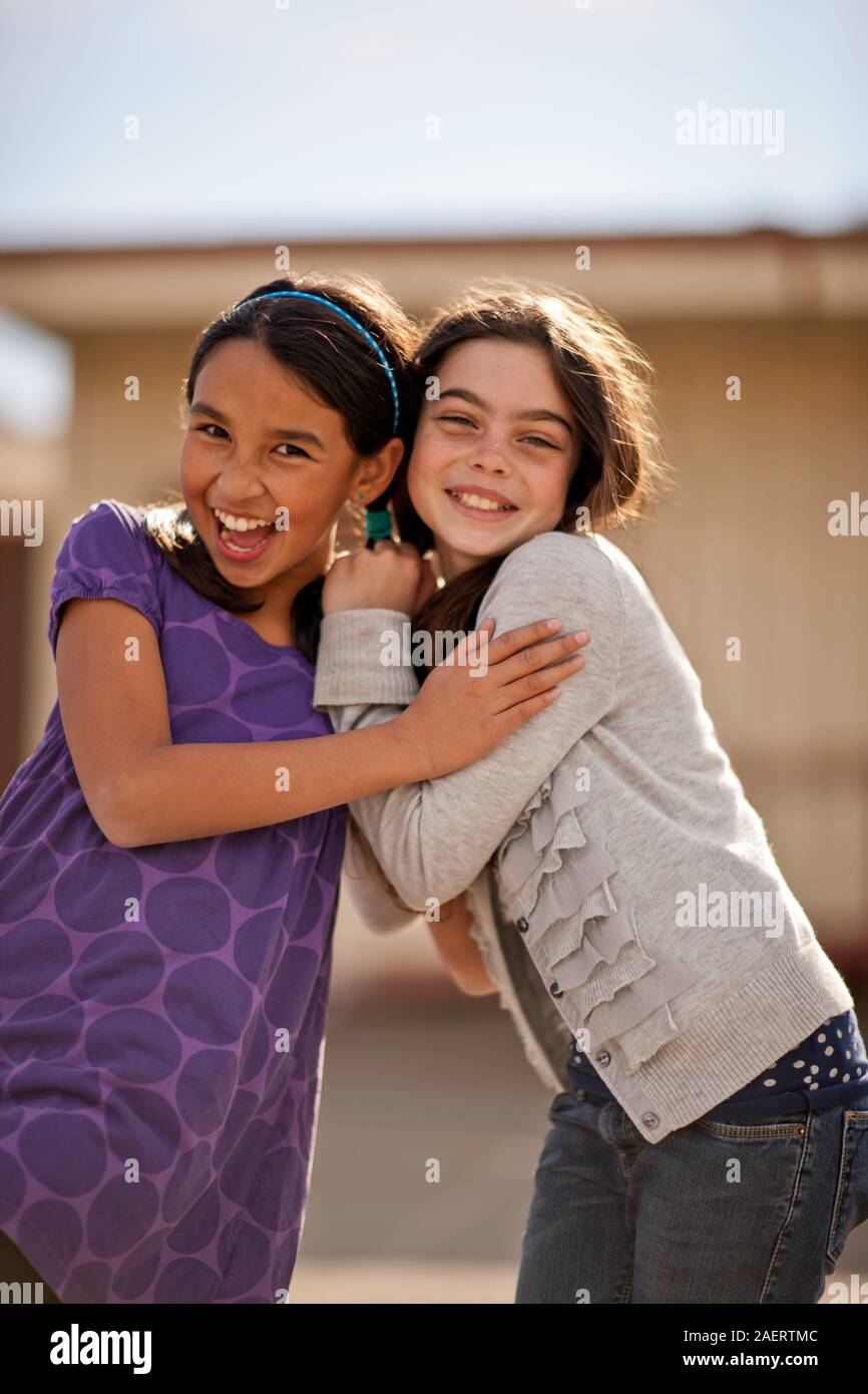 Portrait of two smiling girls Stock Photo - Alamy