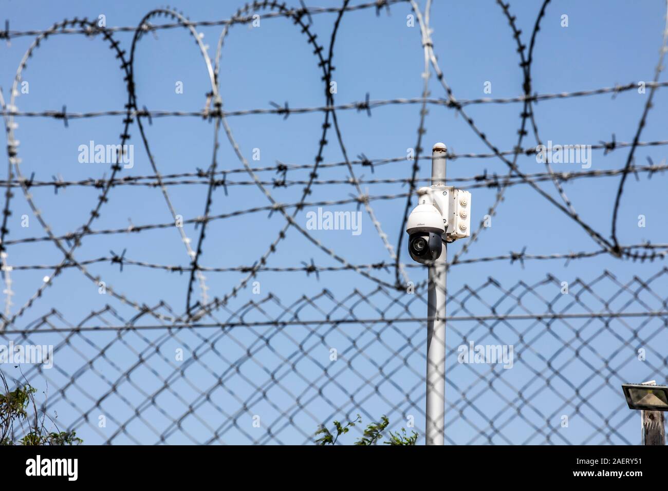 Cctv camera barbed wire fence hi-res stock photography and images - Alamy