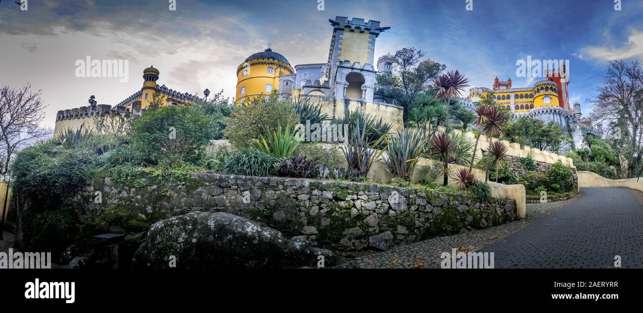 Colorful fairytale Pena Palace in Sintra with dramatic sunset sky one ...
