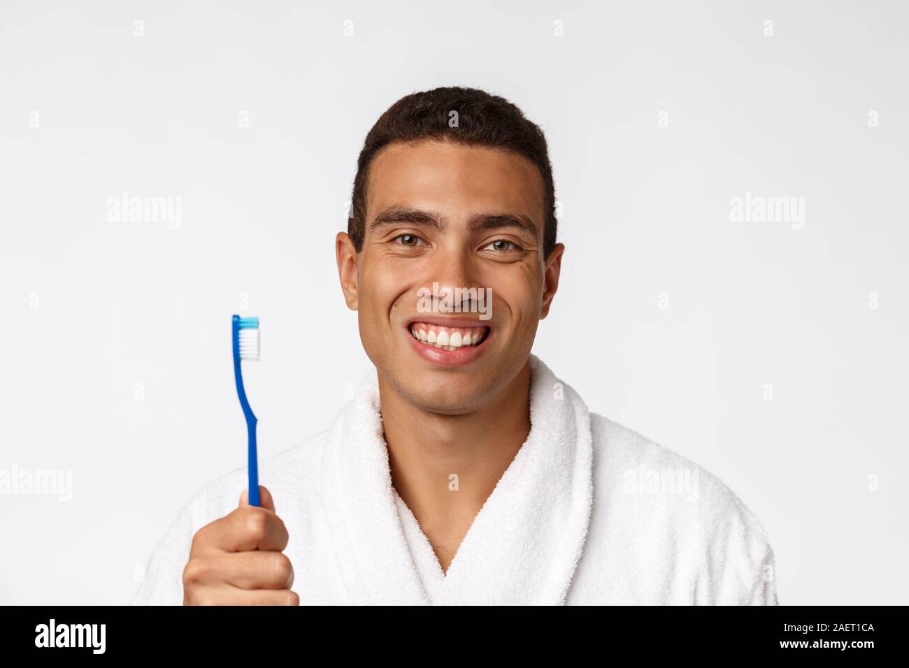 Man with tooth brush. African man holding a toothbrush with tooth brush ...